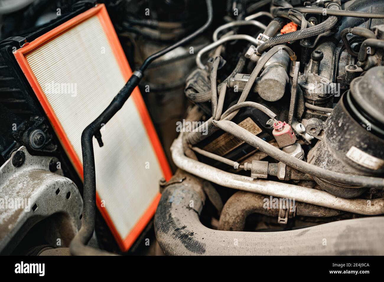 Dirty engine under the hood of a car Stock Photo - Alamy