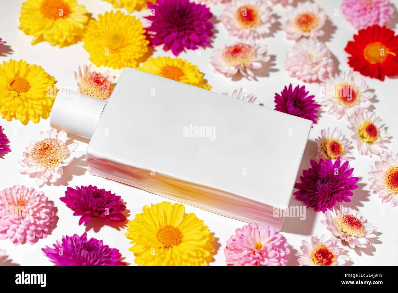 Perfume bottle for women in flower buds Stock Photo - Alamy