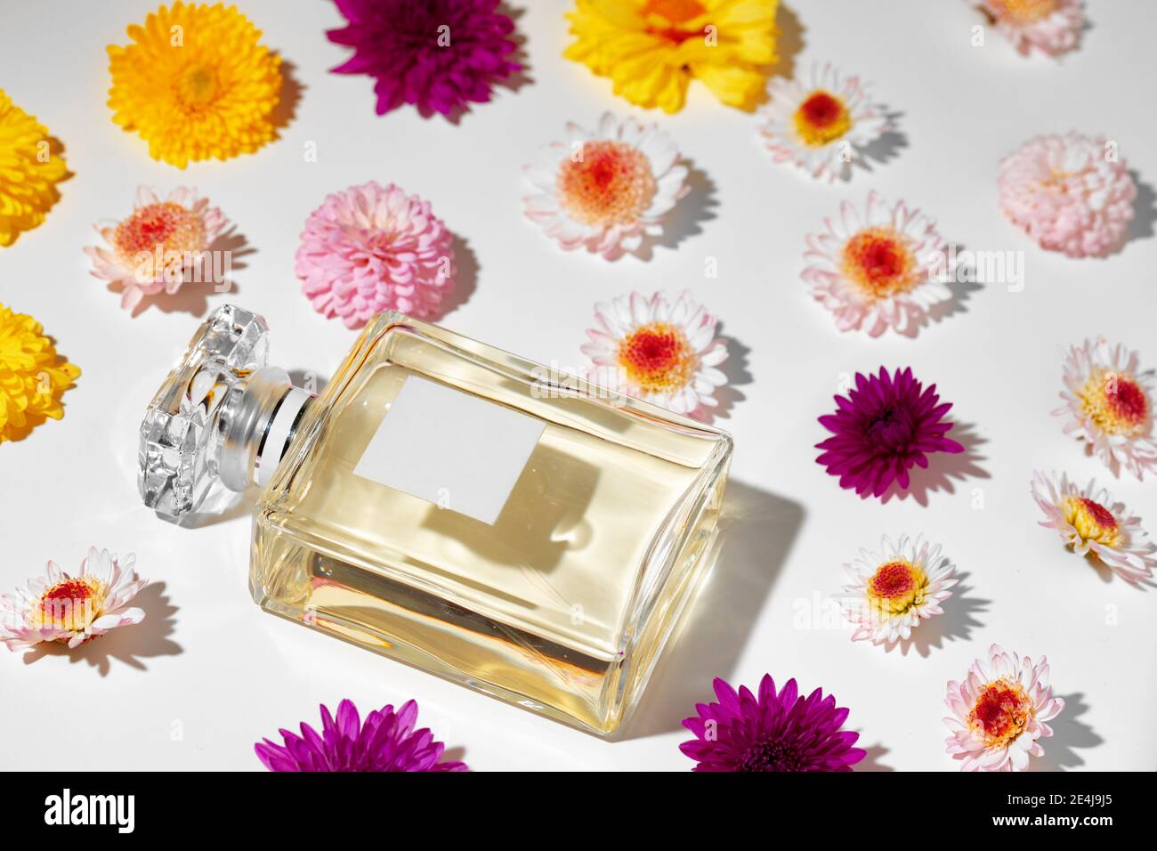 Perfume bottle for women in flower buds Stock Photo - Alamy