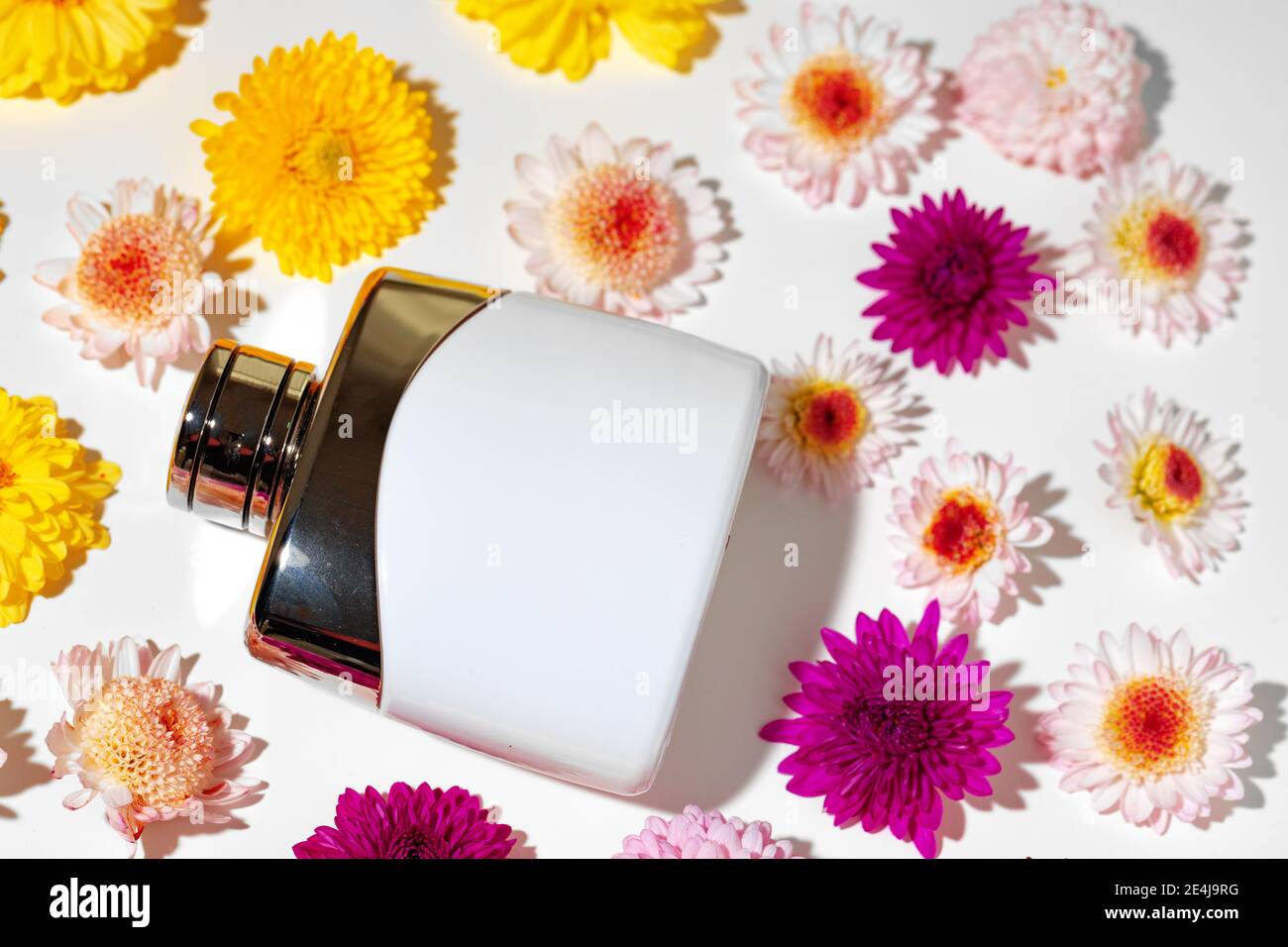 Perfume bottle for women in flower buds Stock Photo - Alamy