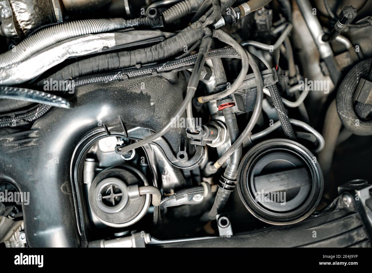 Dirty engine under the hood of a car Stock Photo - Alamy