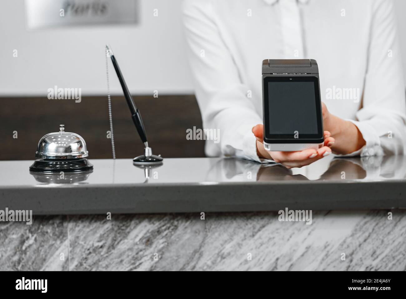Close up of modern hotel reception counter desk Stock Photo - Alamy