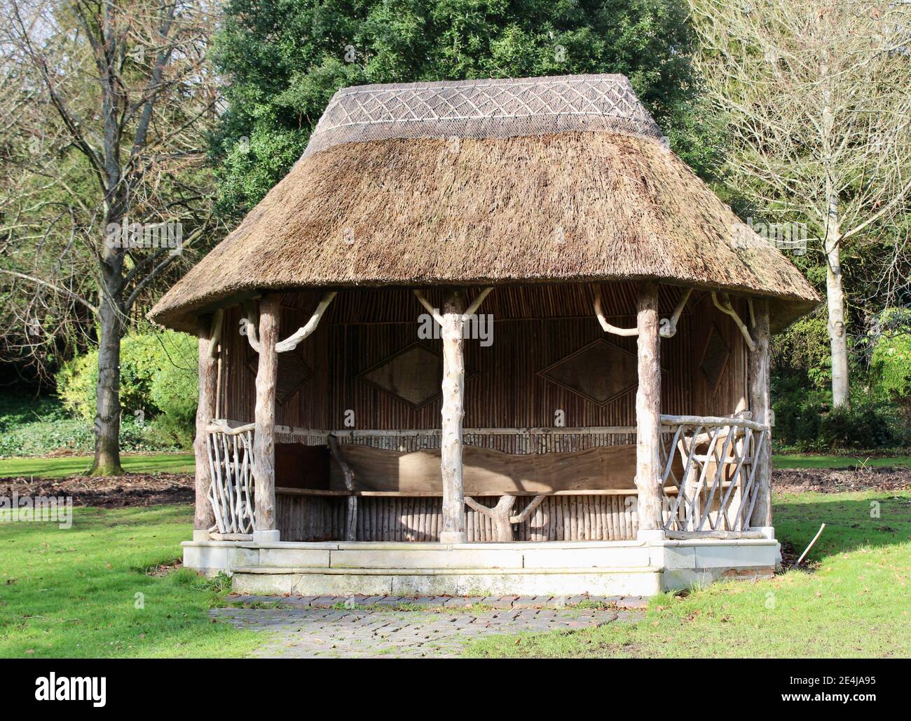 Thatched rustic summer house at West Dean Gardens, West Sussex Stock ...