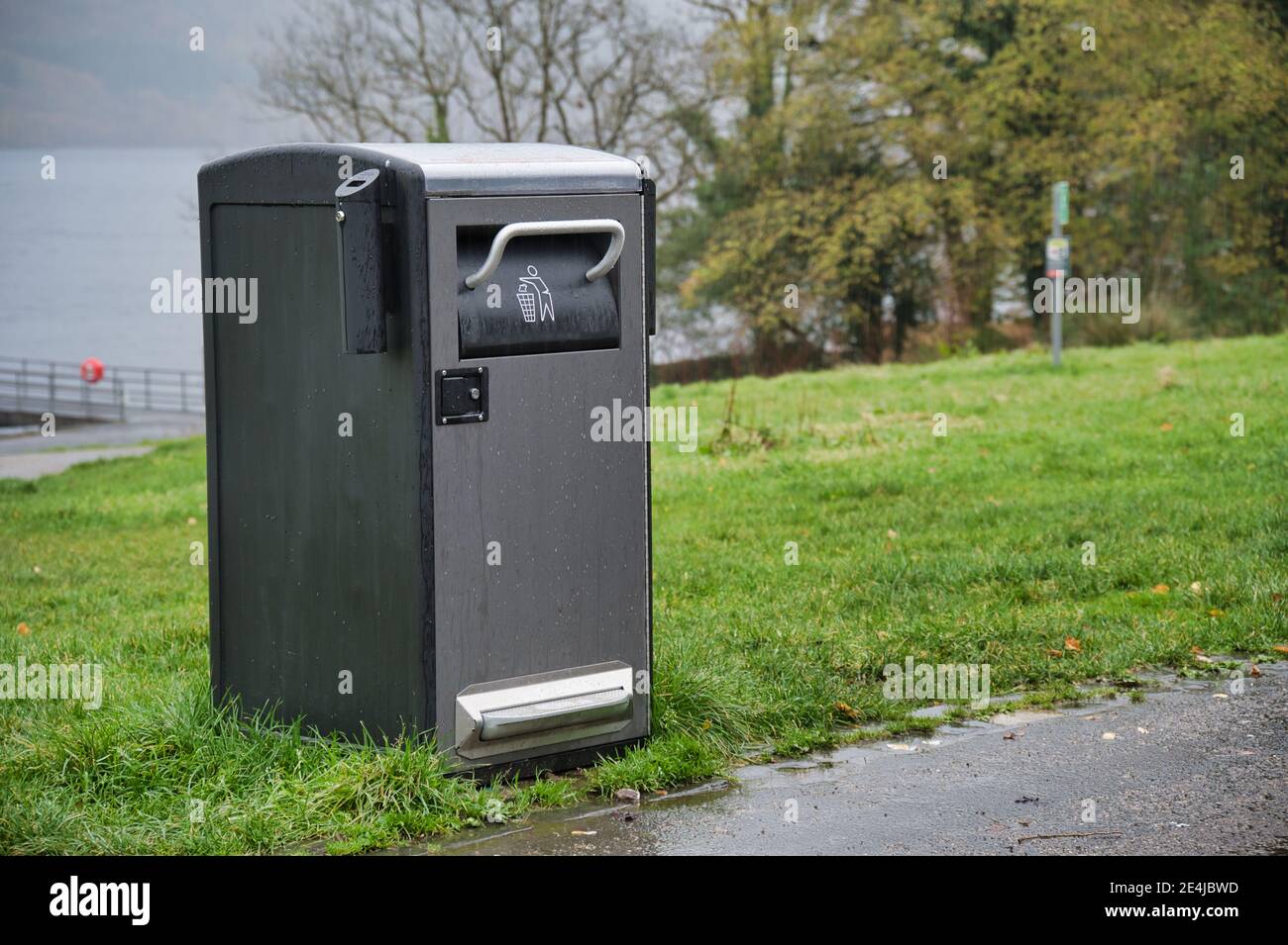 Lever action handle to open block bin at park Stock Photo - Alamy