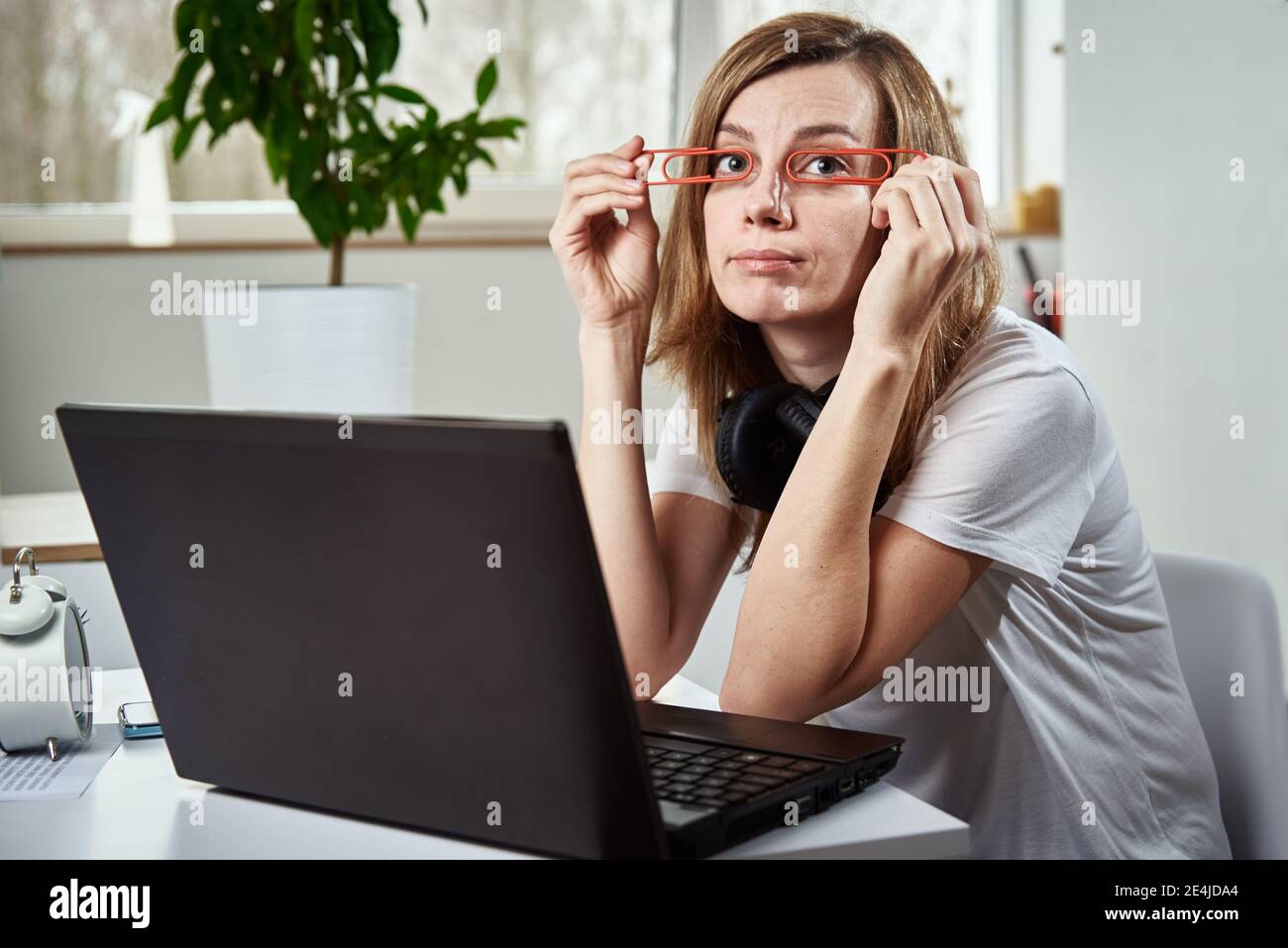 Freelancer woman sitting at workplace and procrastinating. Lazy and ...