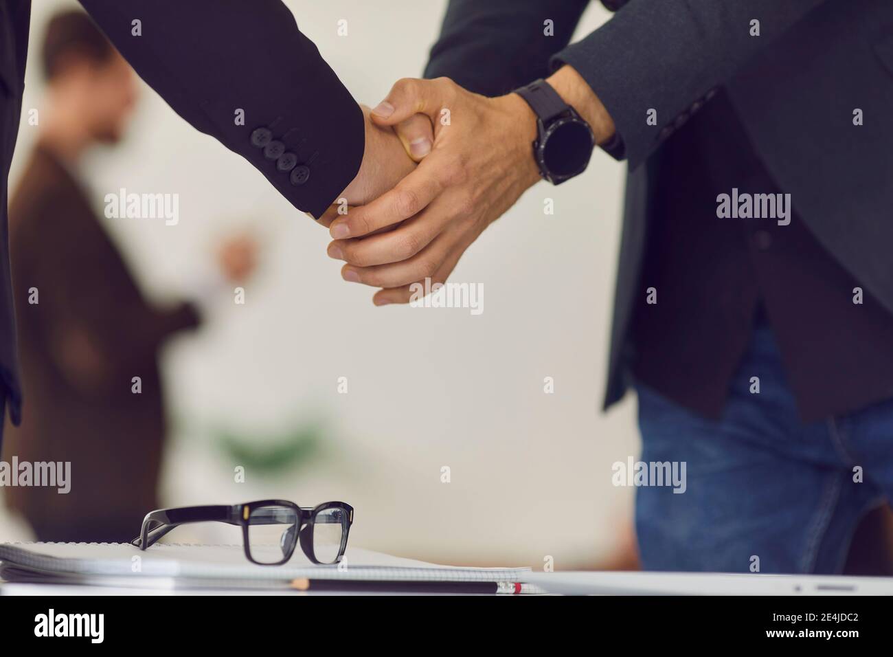 Closeup of a firm handshake between business partners after a ...