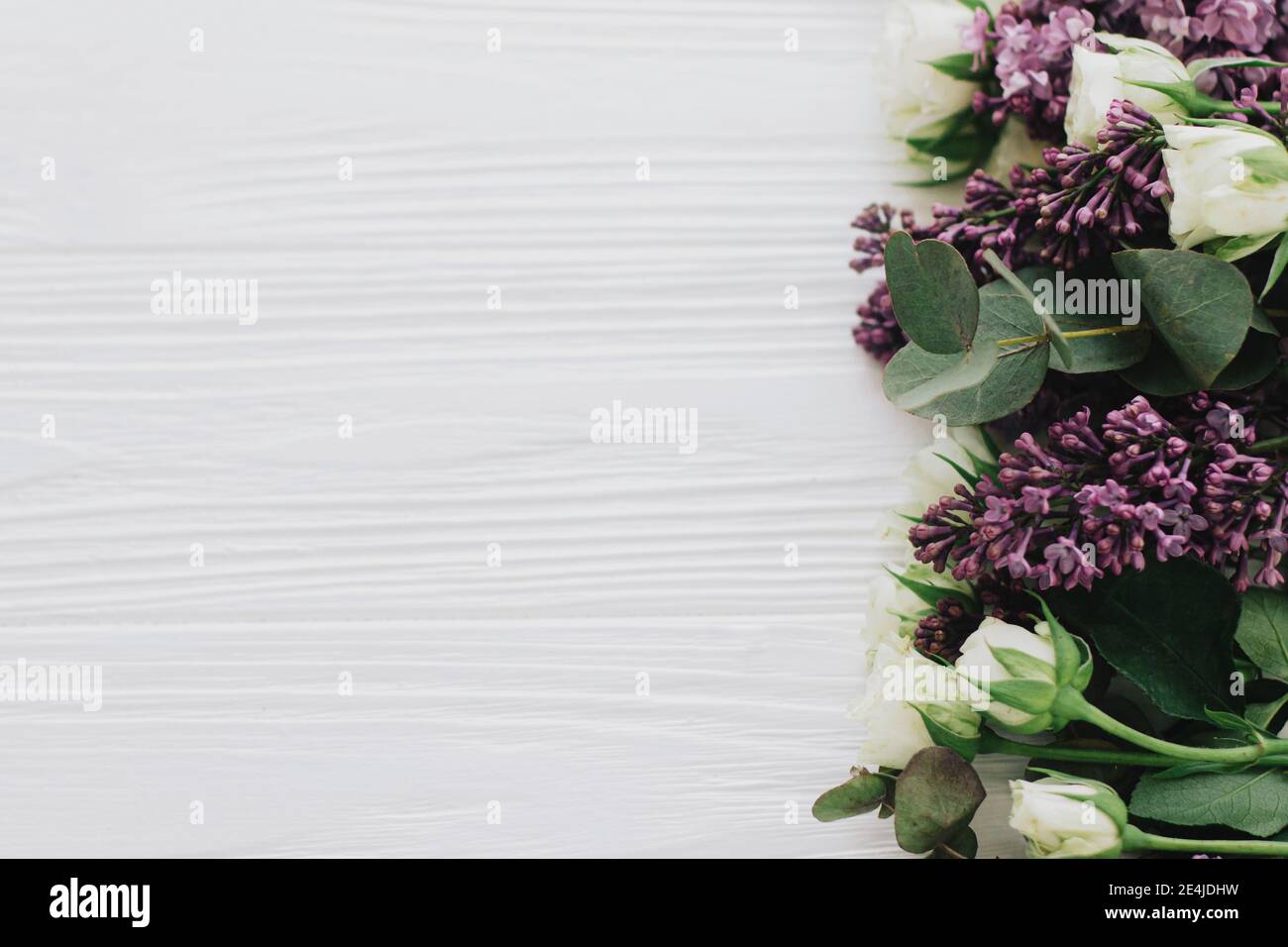 Floral border composition. Stylish lilac and roses border flat lay on ...