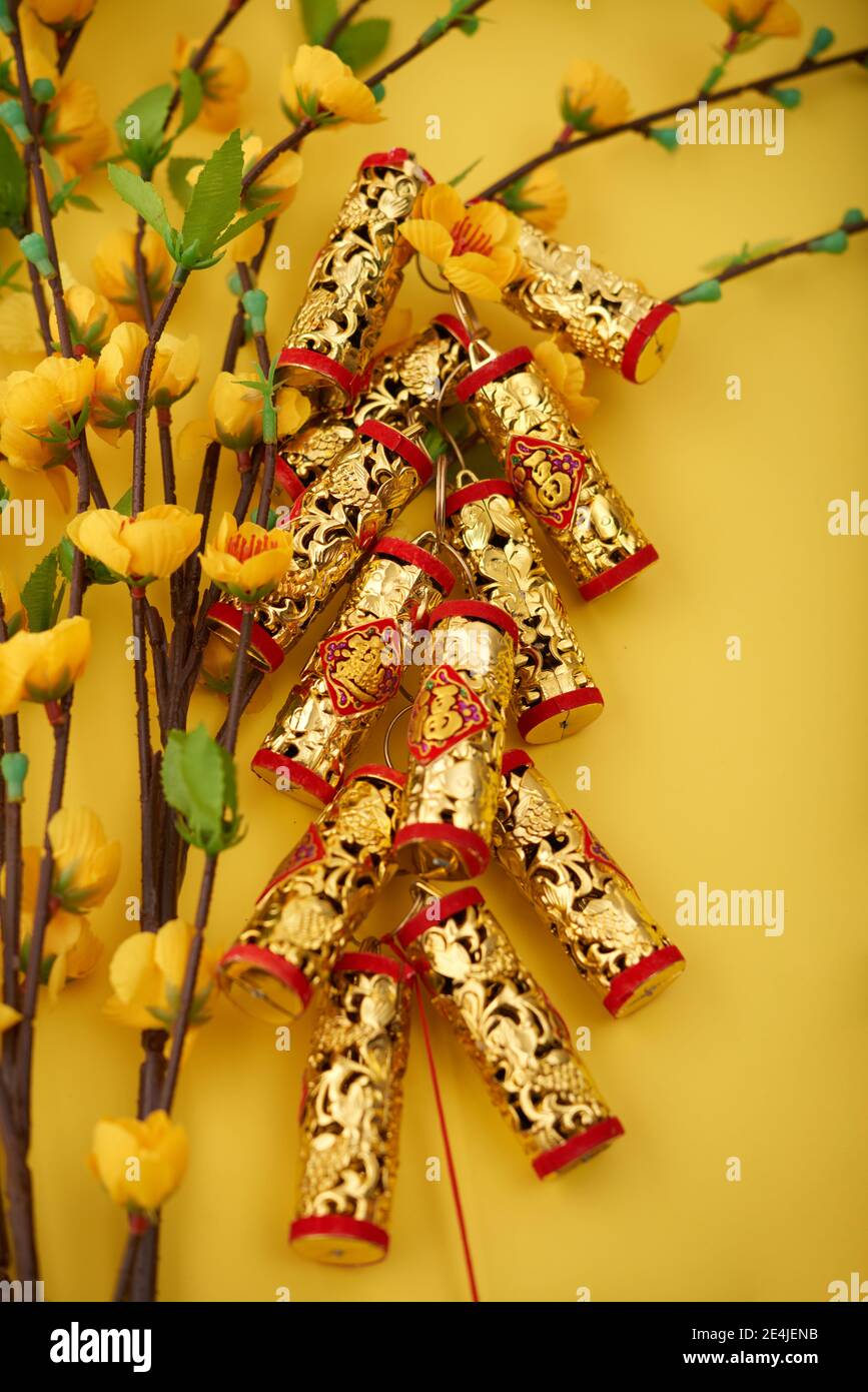 Golden firecrackers for Tet holiday Stock Photo - Alamy