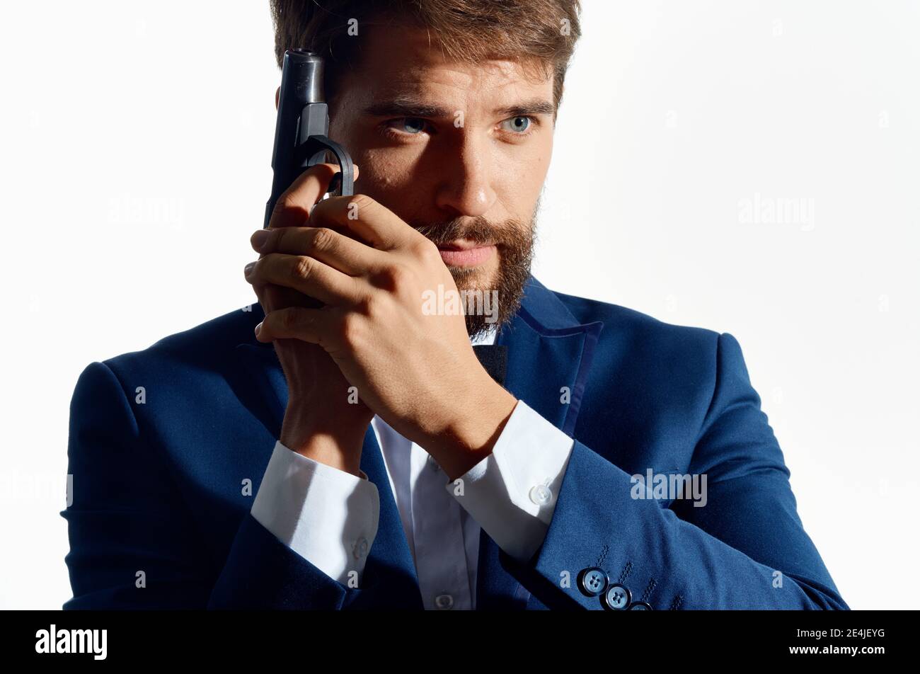 man in suit holding a gun detective crime isolated background Stock ...