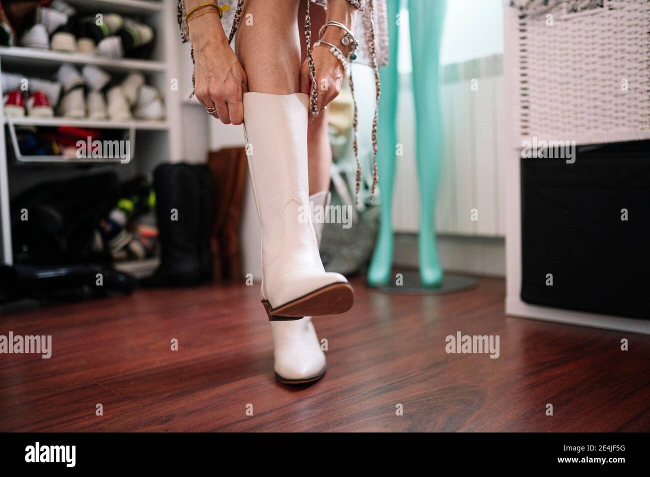 Woman wearing dress spinning while dancing in wardrobe at home Stock ...