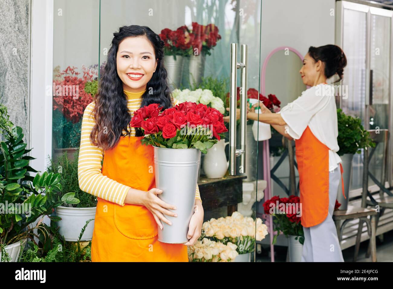 Working in flower shop Stock Photo - Alamy