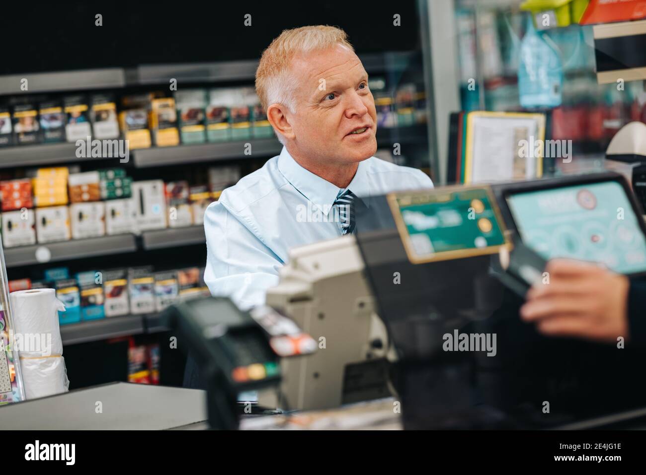 Supermarket cashier male hi-res stock photography and images - Alamy