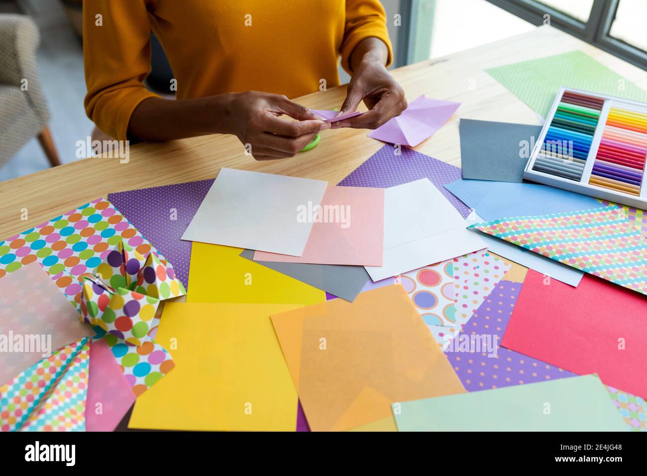 Woman folding paper origami hi-res stock photography and images - Alamy