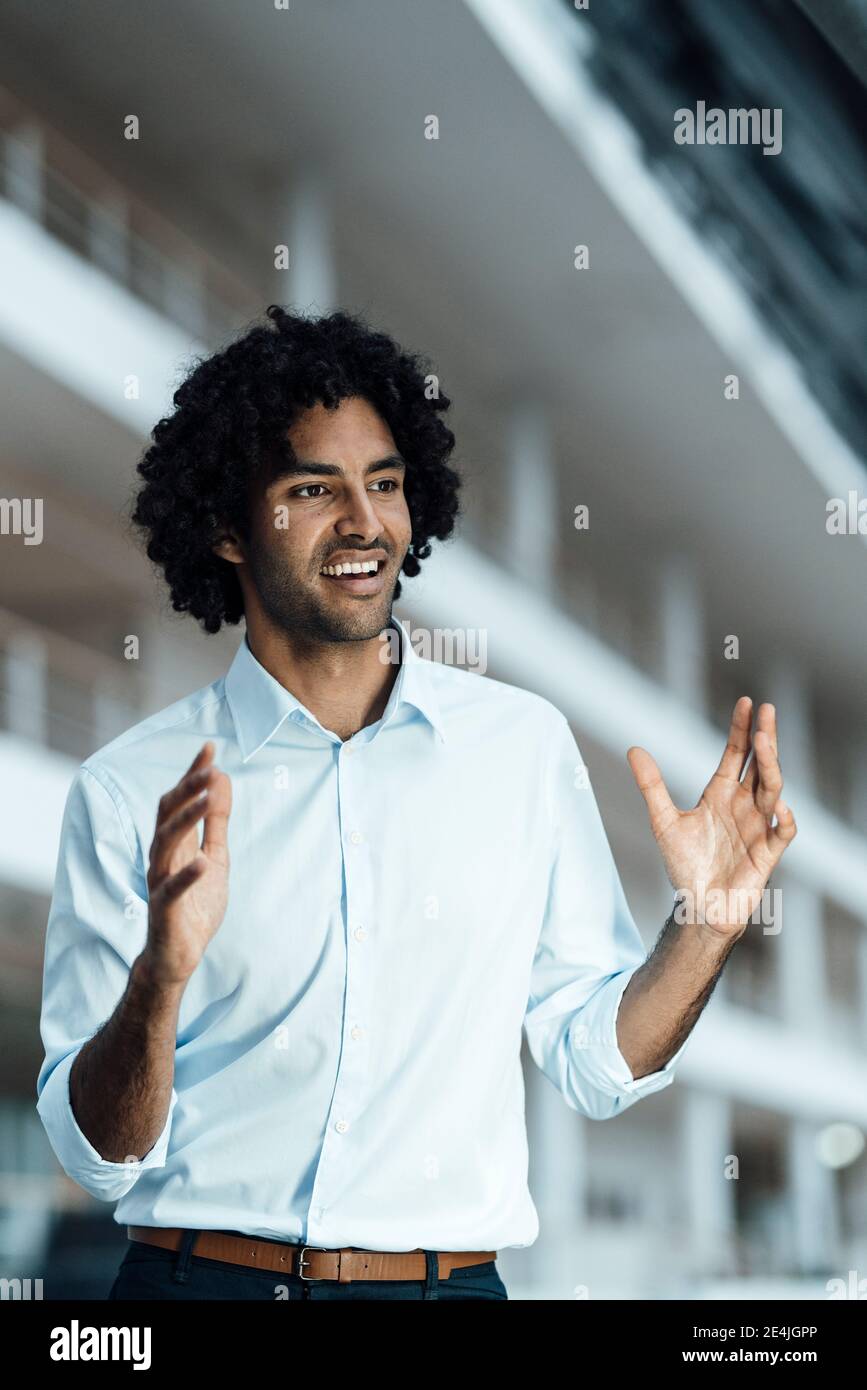 Smiling standing looking away gesturing hi-res stock photography and ...