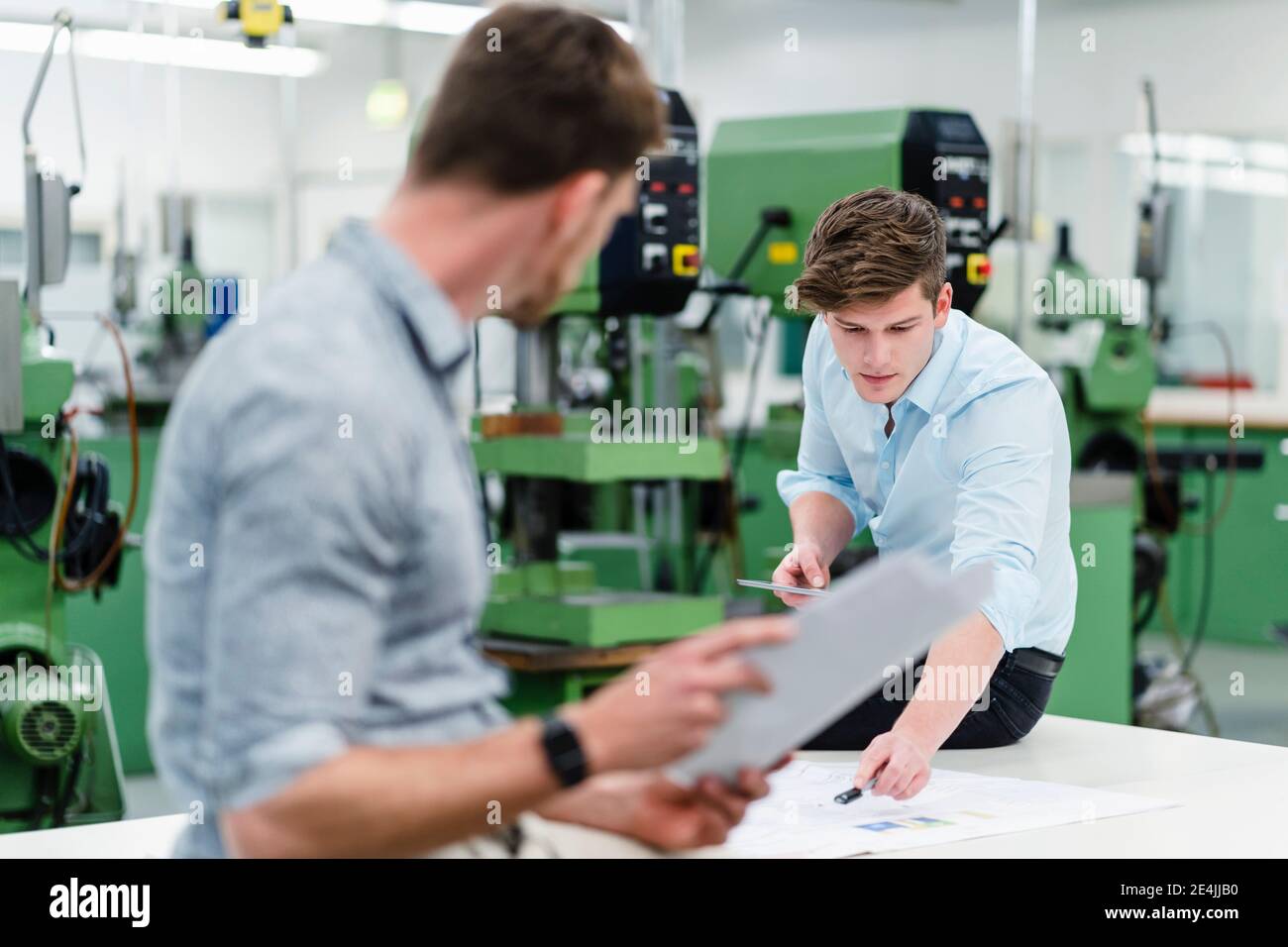 Male colleagues working desk hi-res stock photography and images - Alamy