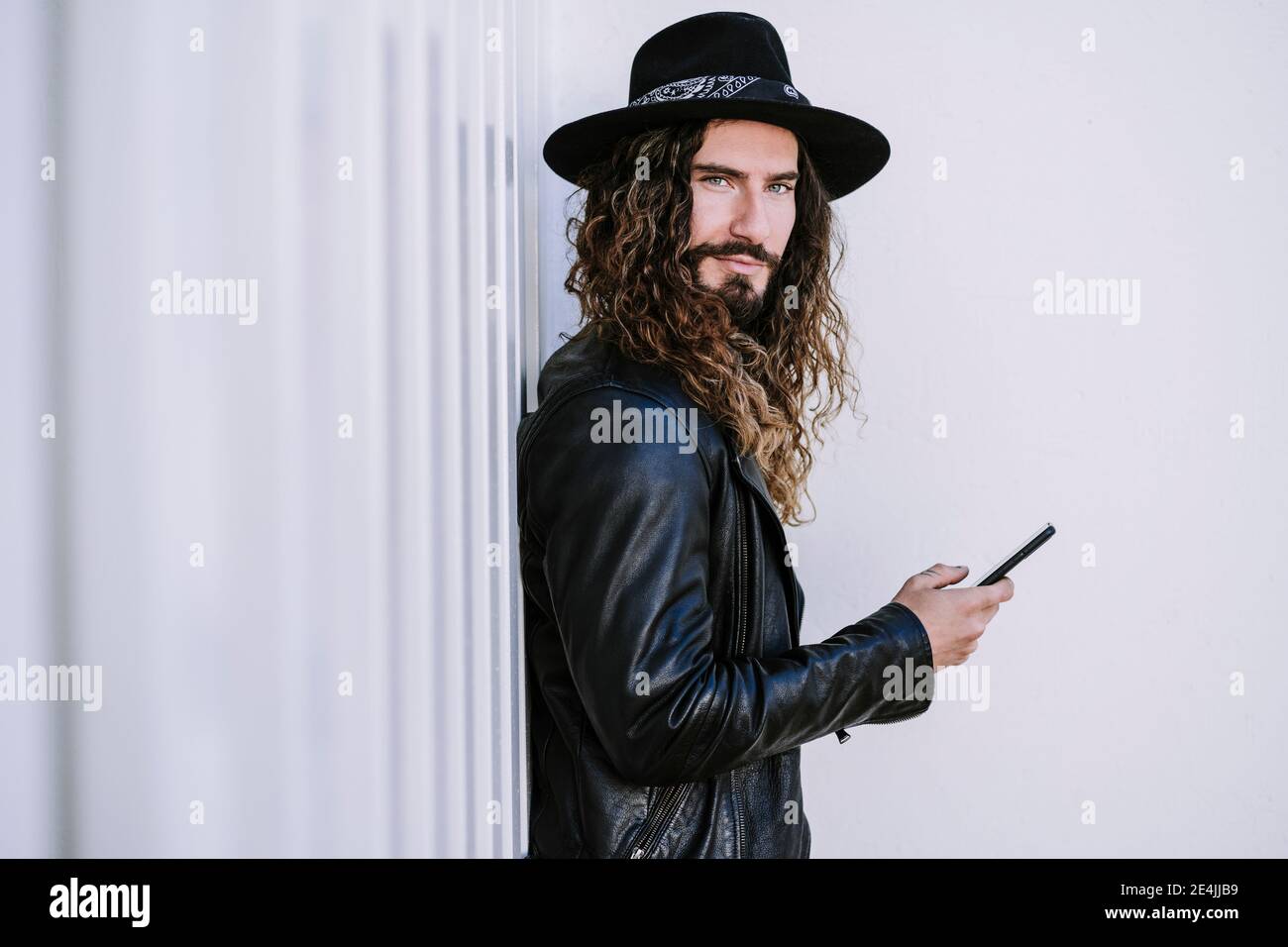 Young confident man holding hi-res stock photography and images - Alamy