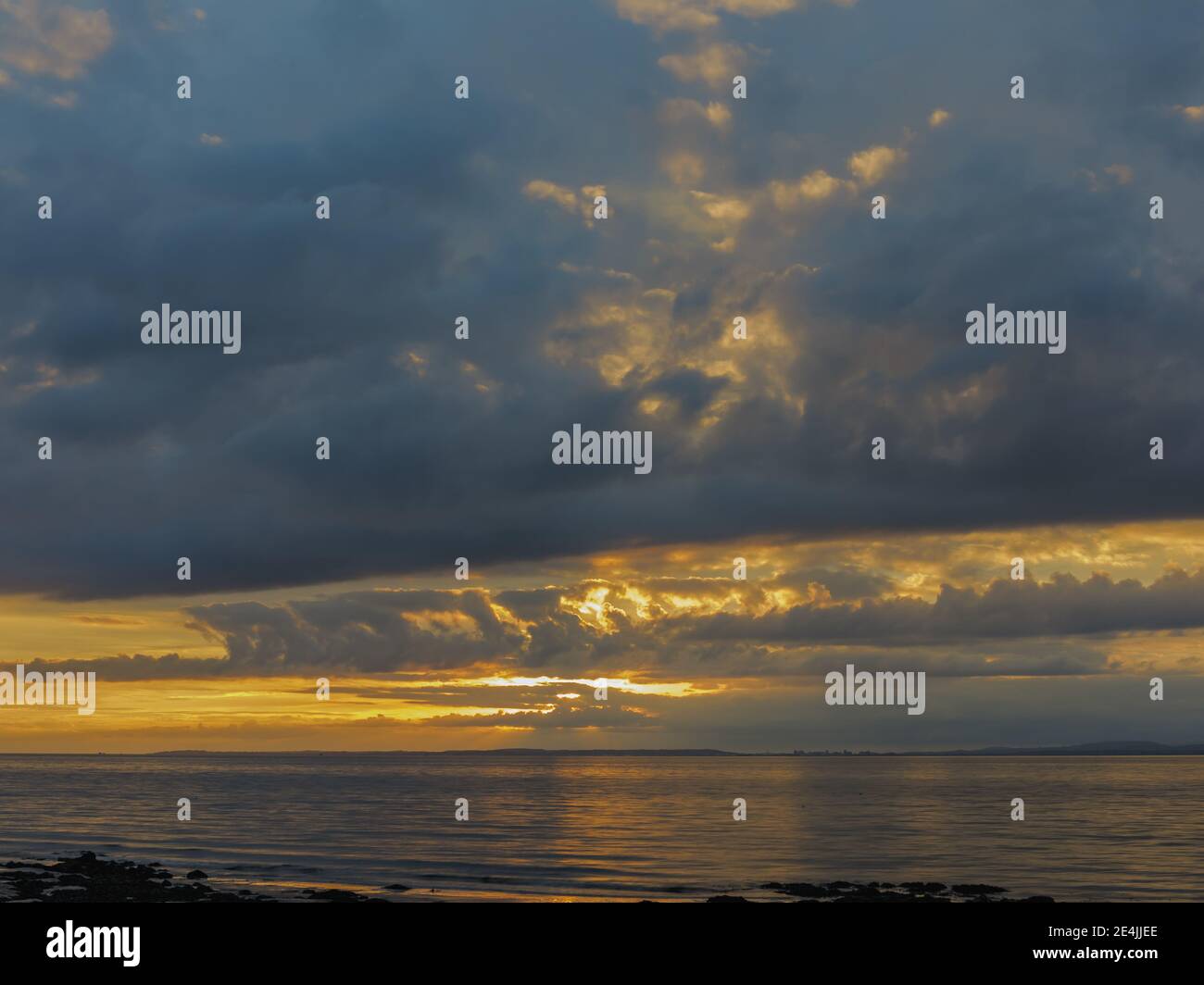 The sun about to set over the horizon Stock Photo - Alamy