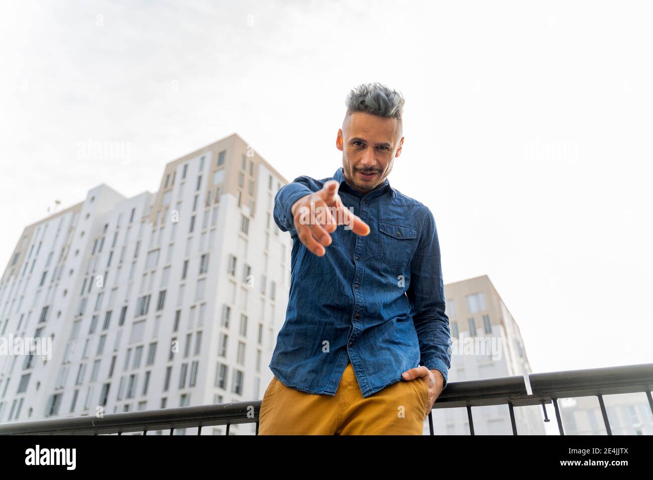 Confident man pointing camera in hi-res stock photography and images ...
