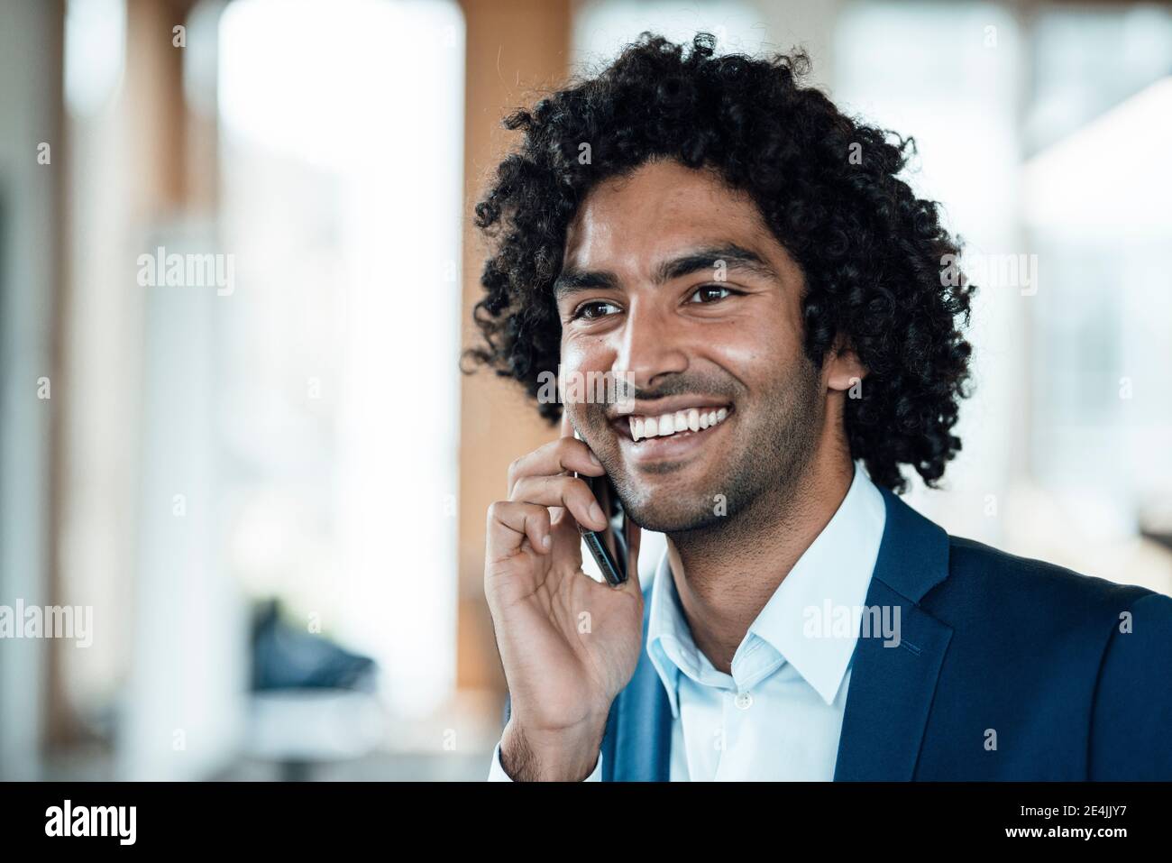 Portrait cheerful young businessman talking hi-res stock photography ...