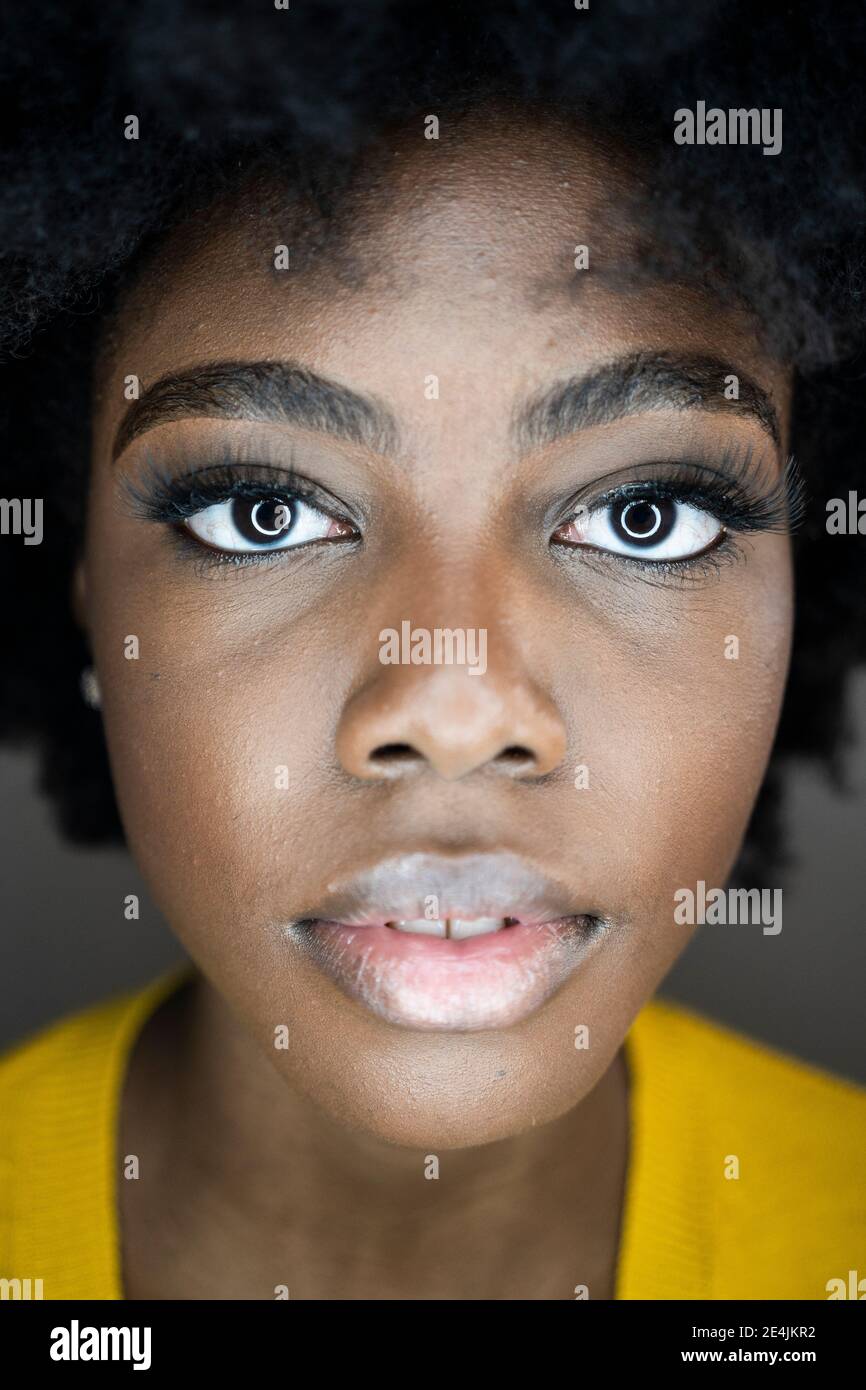 Close-up of young woman face with circle flash reflection in eyes Stock ...