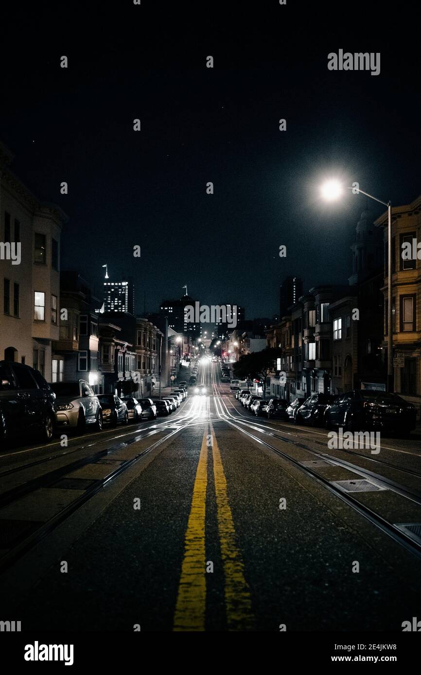 city road with tracks at night Stock Photo - Alamy