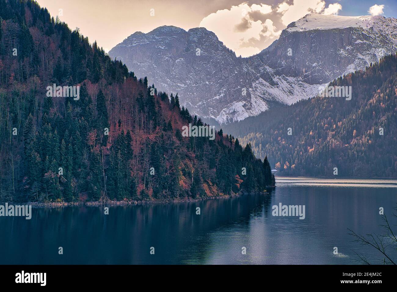 Lake Ritsa surrounded by forested mountains in autumn, Abkhazia ...