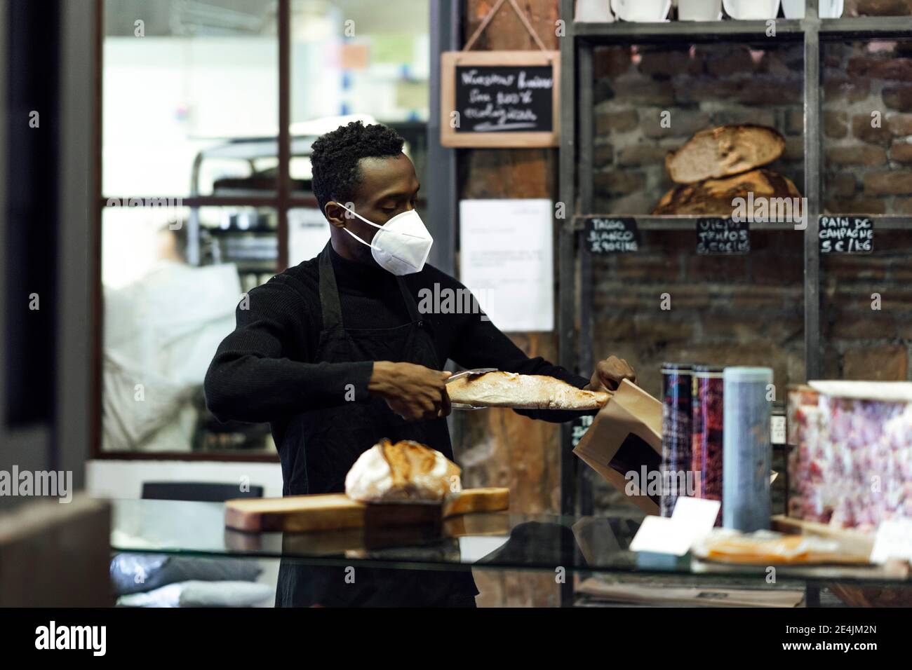 Male bakery owner packing hi-res stock photography and images - Alamy