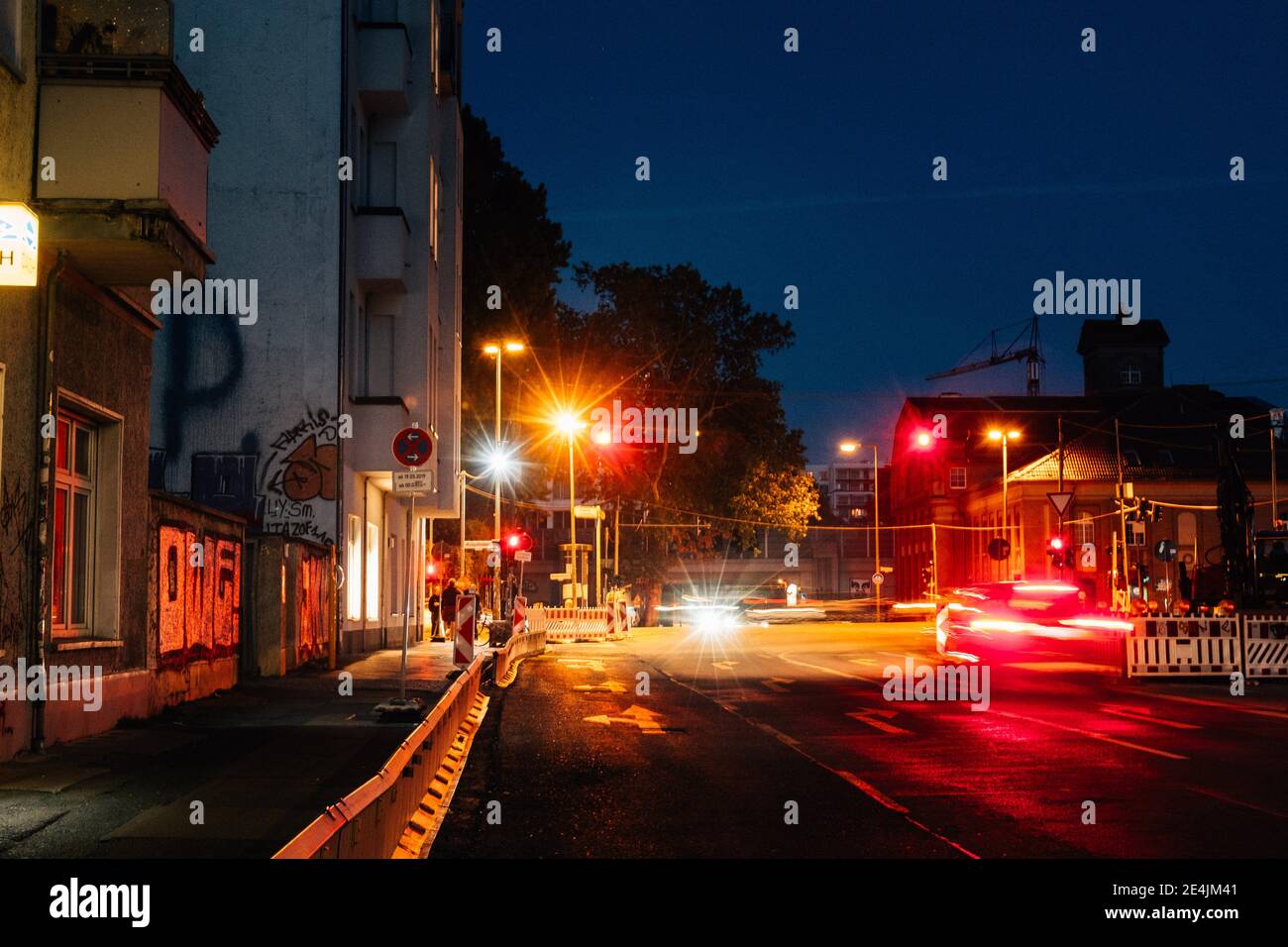 city street illuminated at night time Stock Photo - Alamy