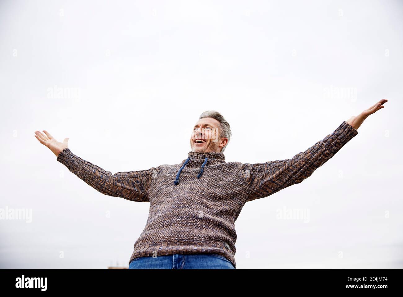 Happy man outstretched arms hi-res stock photography and images - Alamy