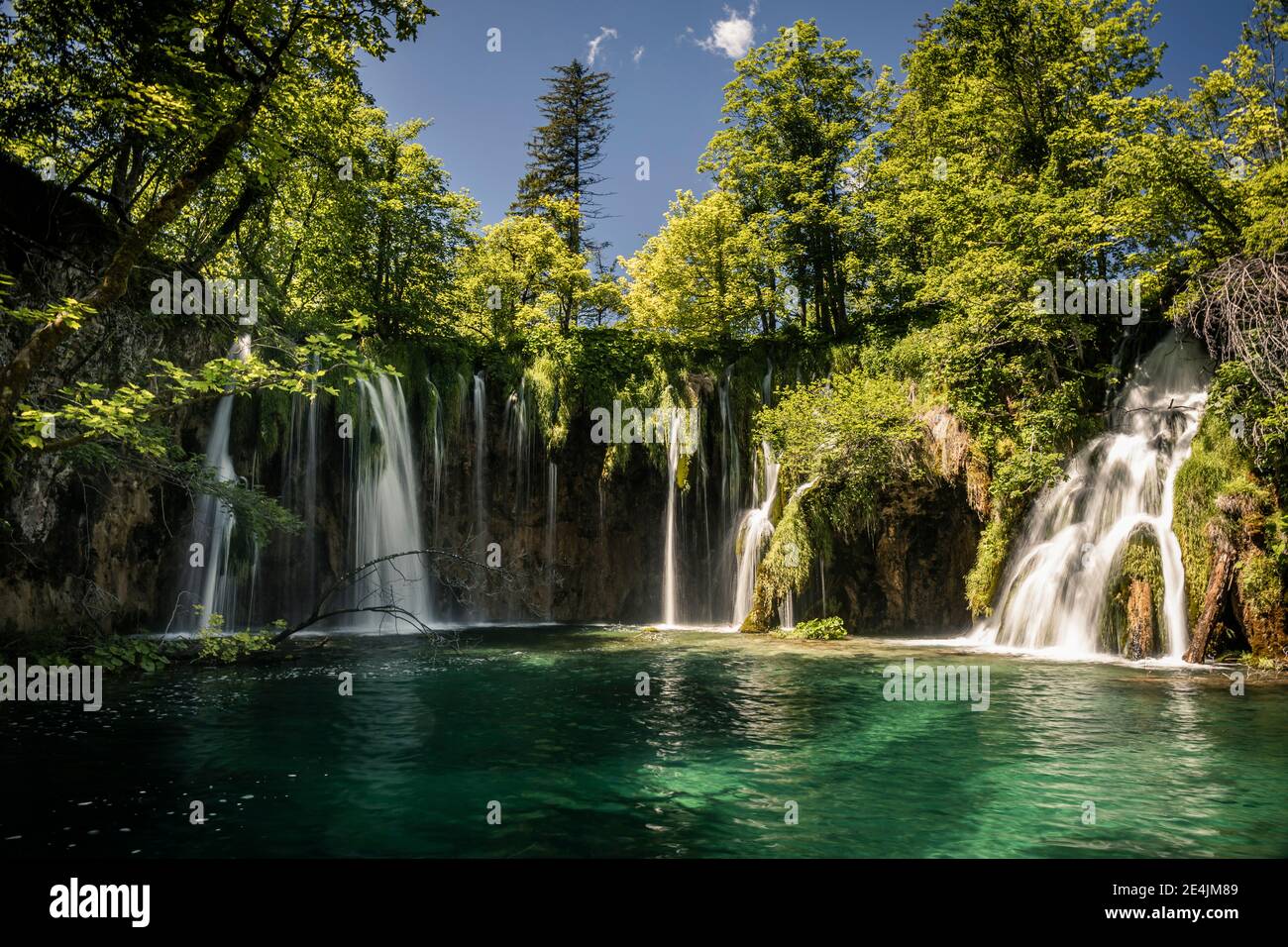 Waterfalls and turquoise lake Stock Photo - Alamy