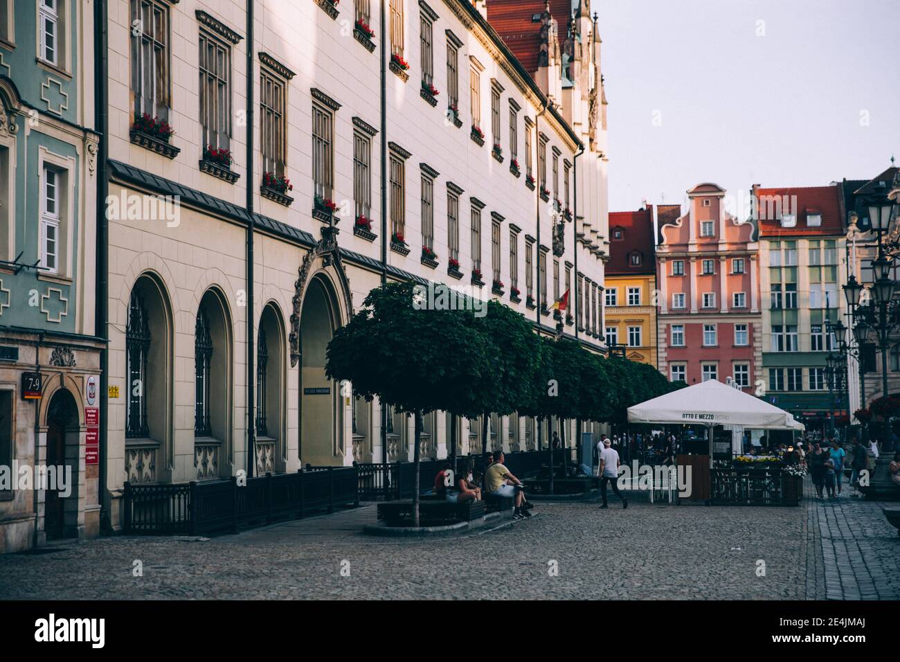 colourful buildings frame outdoor dining in a piazza in italy Stock ...