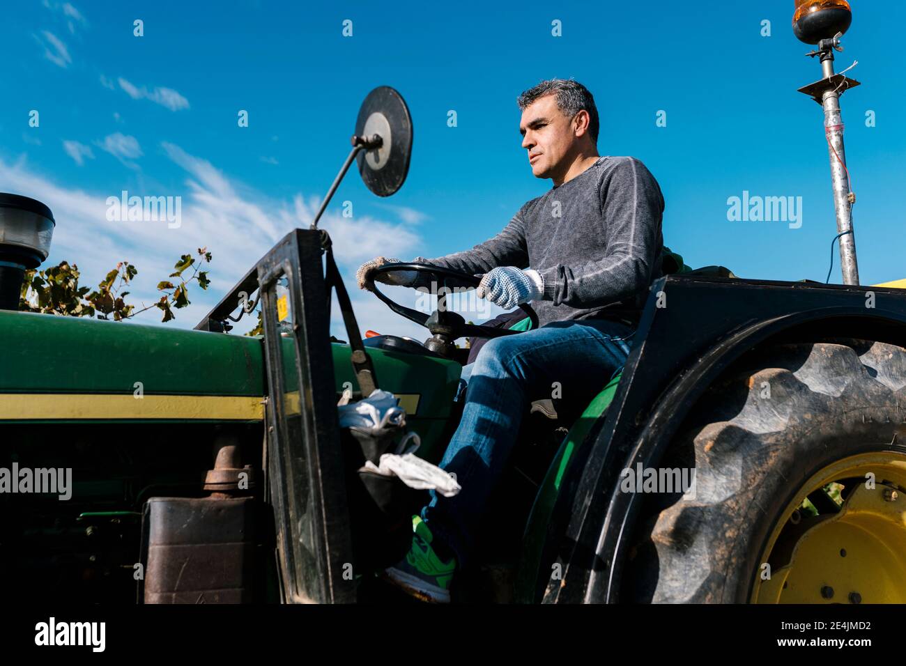 Farmer tractor driving wheel hi-res stock photography and images - Alamy
