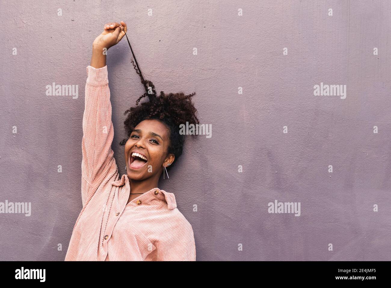 Woman hands raised holding hi-res stock photography and images - Alamy