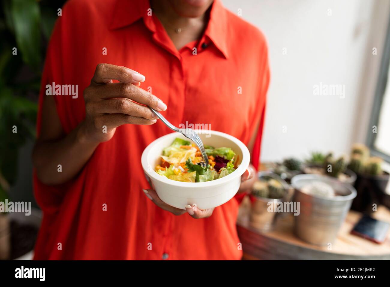 African woman eating salad hi-res stock photography and images - Alamy