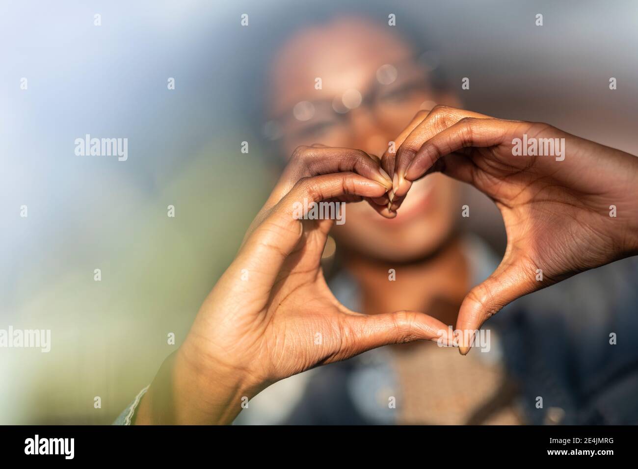 Hands of woman showing heart sign Stock Photo - Alamy