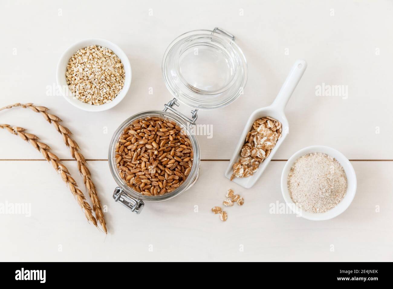 Wheat in form of flour, grains and flakes Stock Photo - Alamy