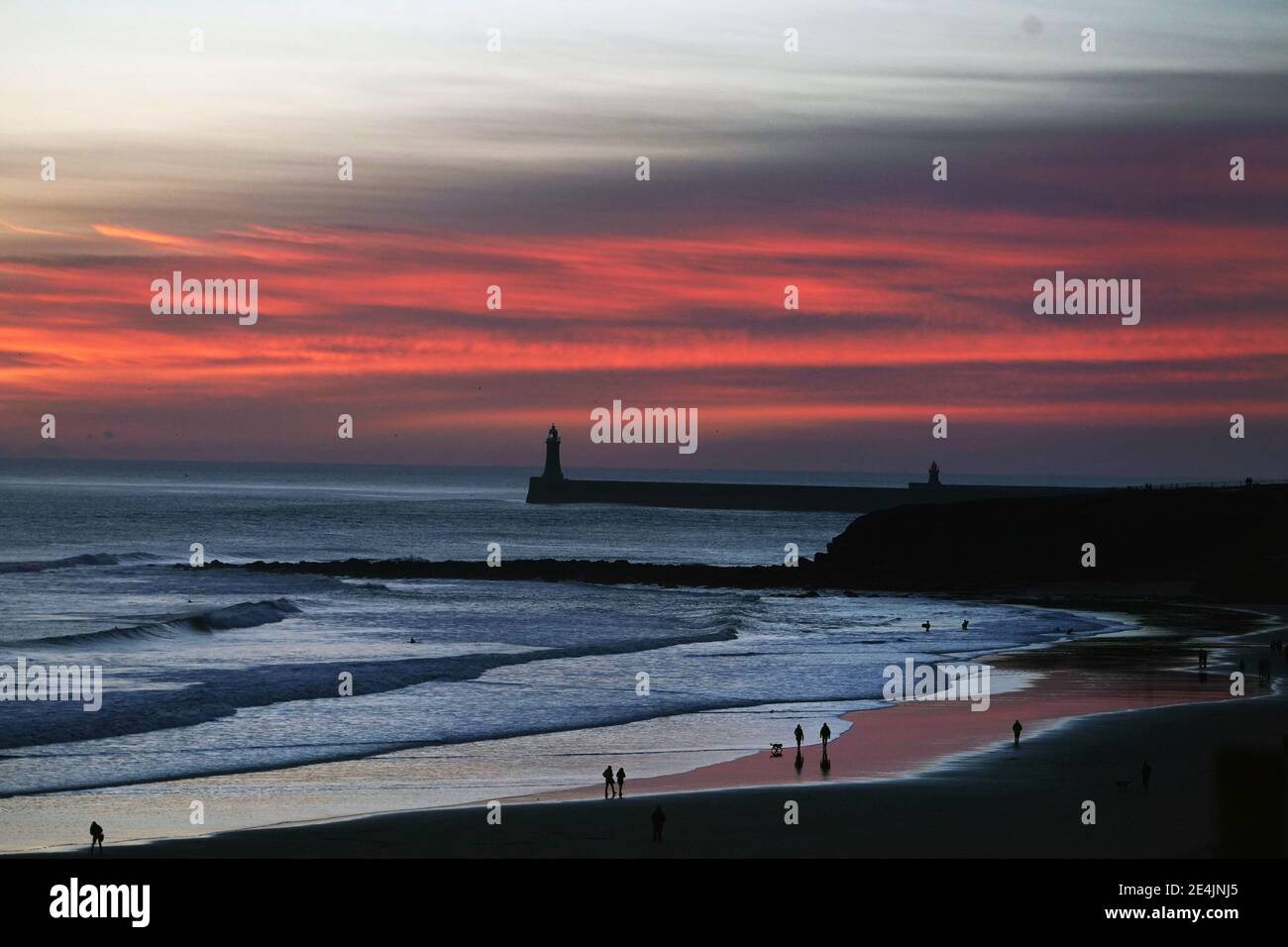 A pink sky over tynemouth beach on the North East coast of England ...