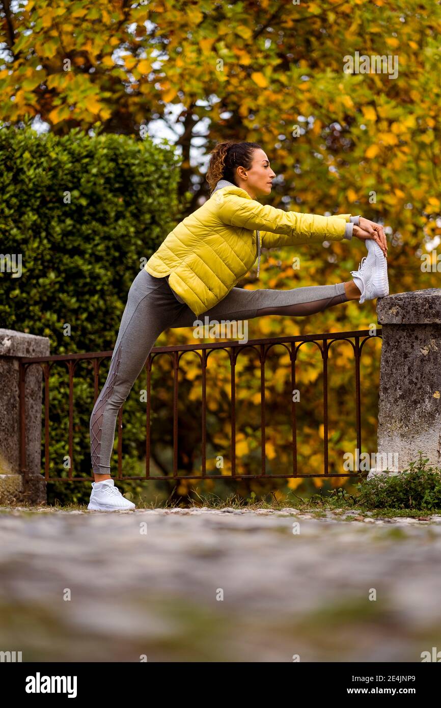 Standing stretching hi-res stock photography and images - Alamy