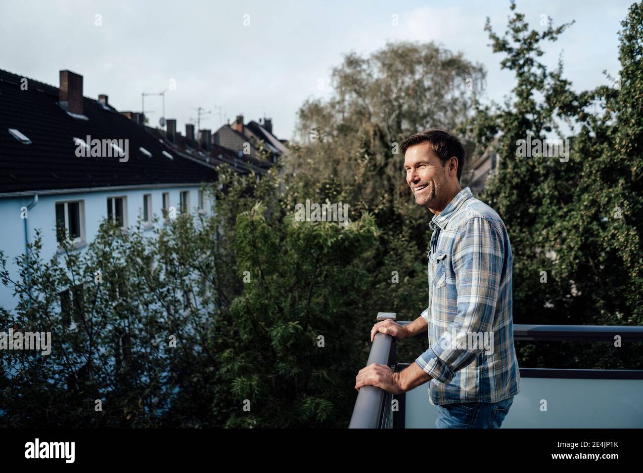 Man standing balcony balcony hi-res stock photography and images - Alamy