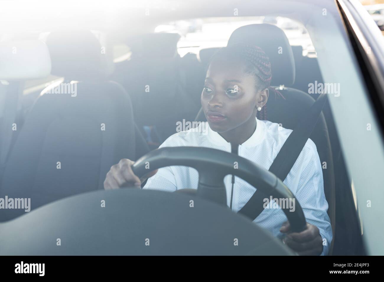 Woman driving seen through windshield of car hi-res stock photography ...