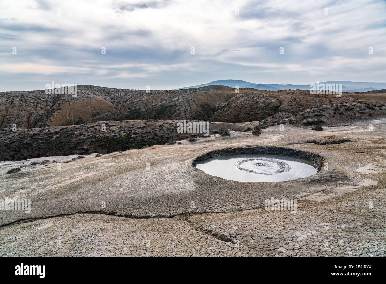 Large crater of mud volcano Stock Photo - Alamy