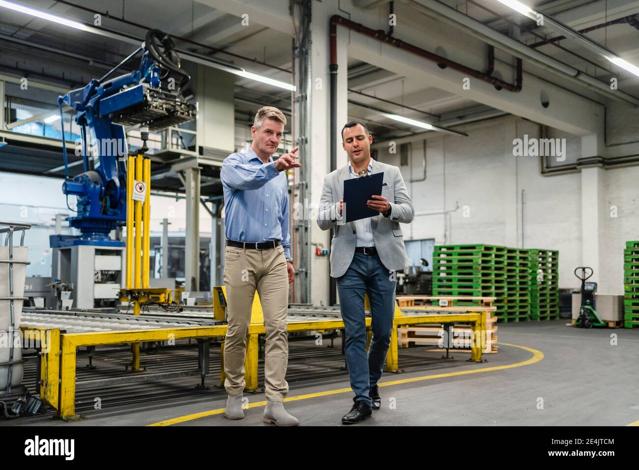 Business man walking into factory hi-res stock photography and images ...