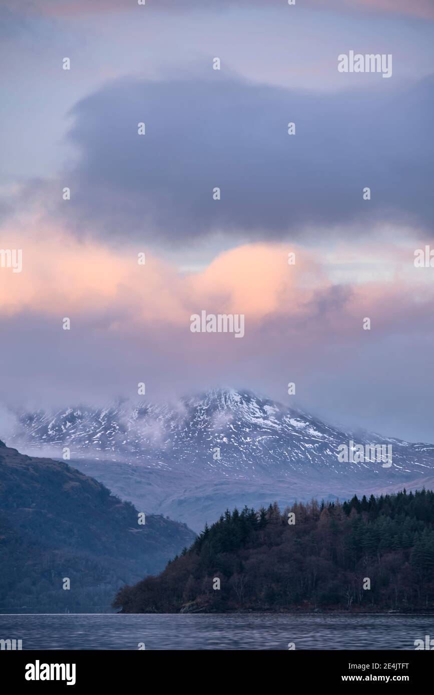 Beautiful landscape image across Loch Lomond looking towards snow ...