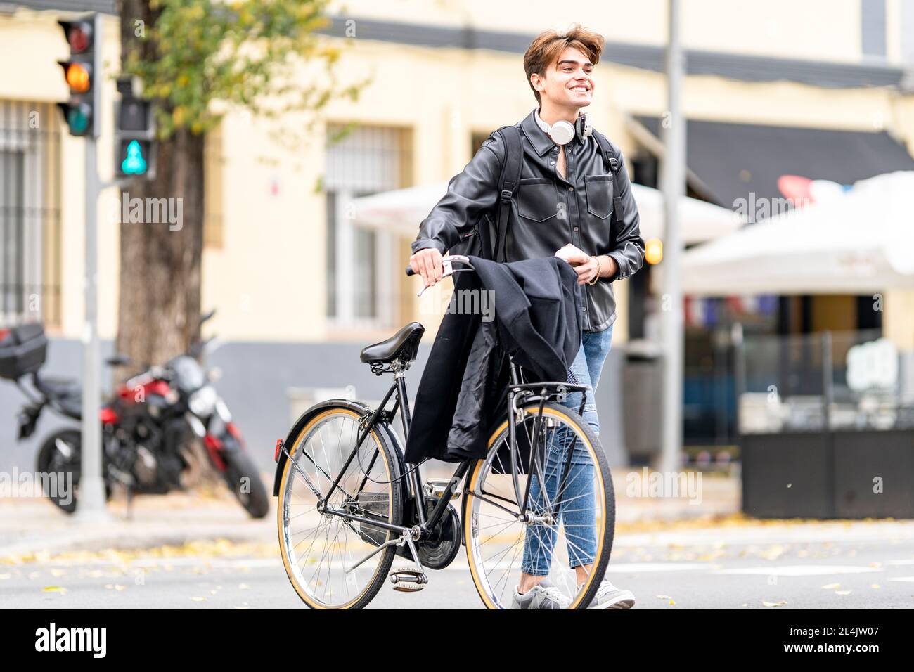 Man walking bicycle hi-res stock photography and images - Alamy