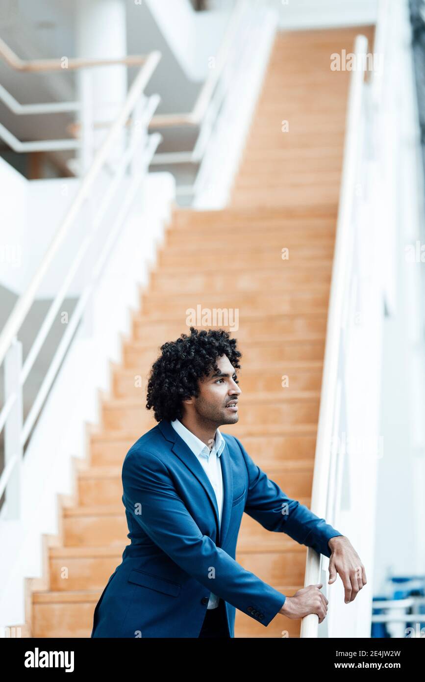 Pensive businessman leaning on railing hi-res stock photography and ...