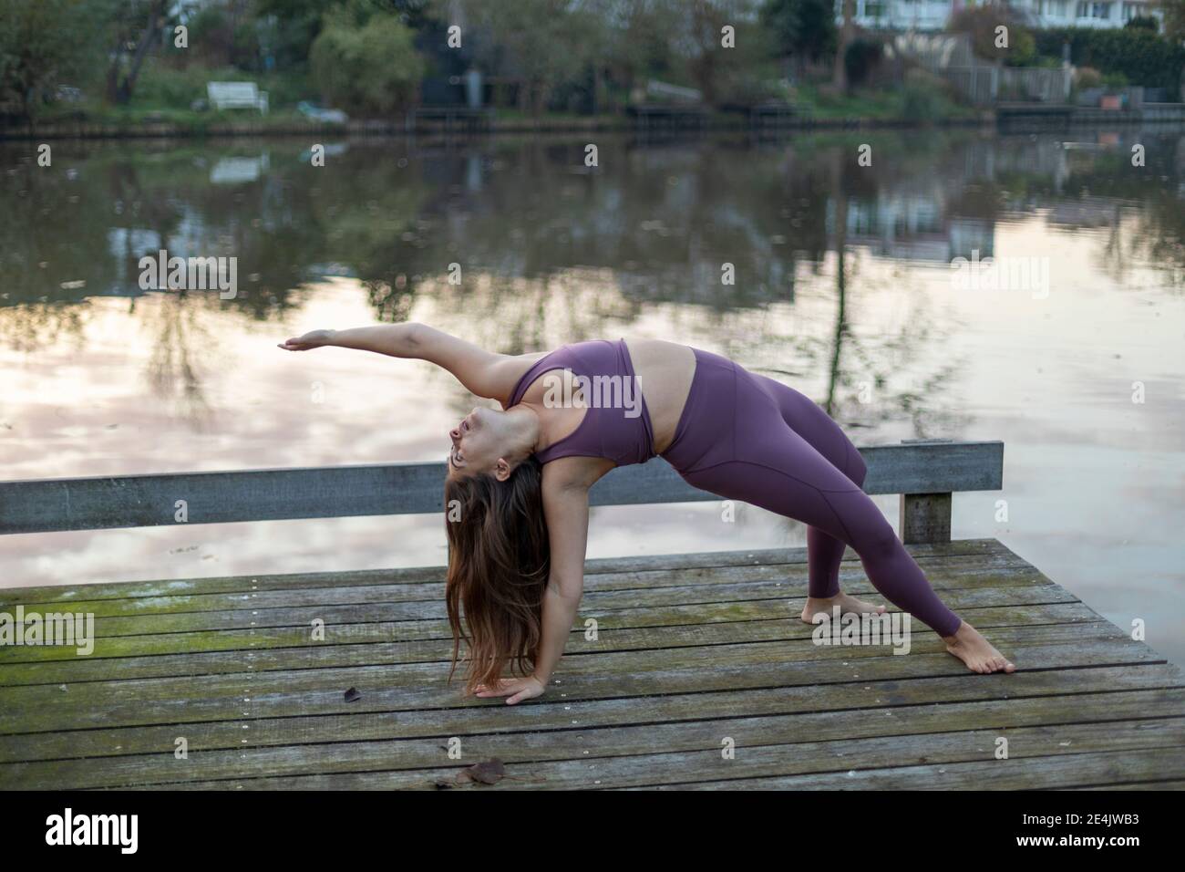 Young woman bending over outdoors hi-res stock photography and images ...