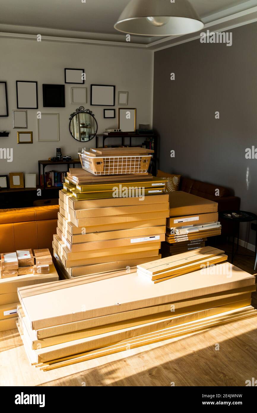 Stack of carton boxes at home on sunny day Stock Photo - Alamy