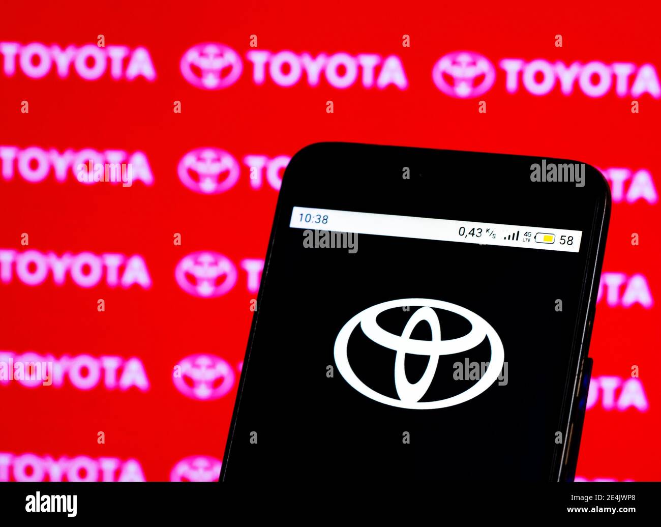 In this photo illustration a Toyota Motor logo seen displayed on smart ...