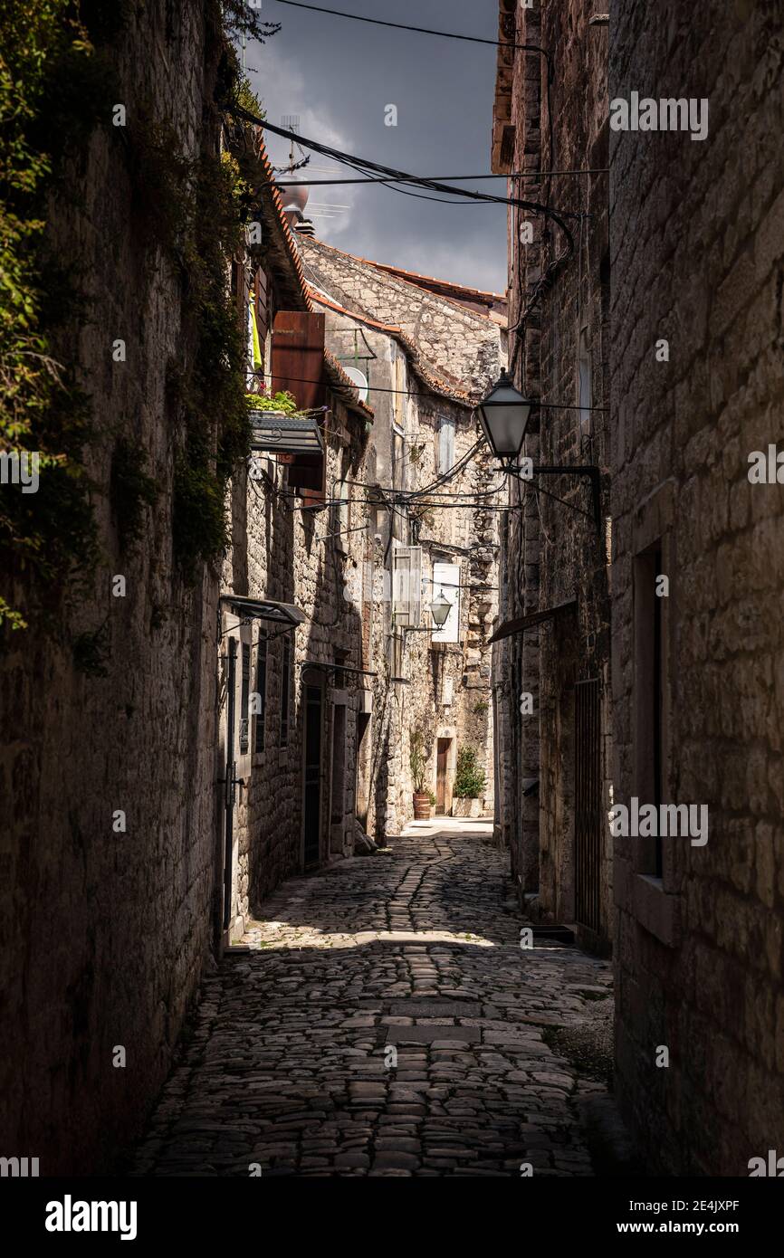 Narrow alley in old town Stock Photo - Alamy