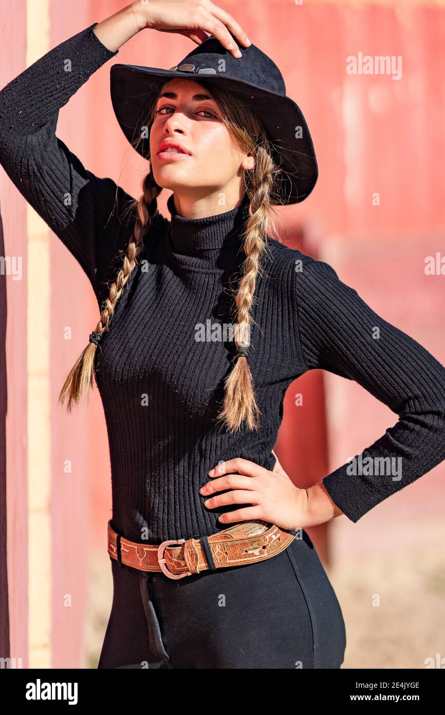 Portrait of female rancher in black hat Stock Photo - Alamy